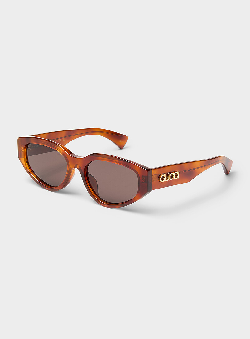 Angular cat-eye sunglasses | Gucci | | Simons
